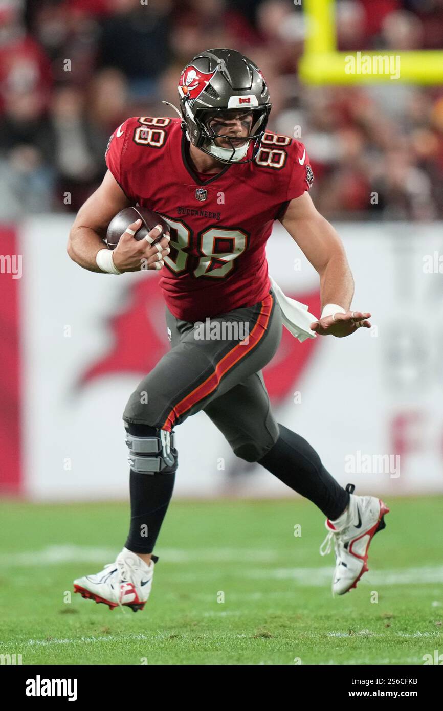 Tampa Bay Buccaneers tight end Cade Otton (88) runs after a catch ...