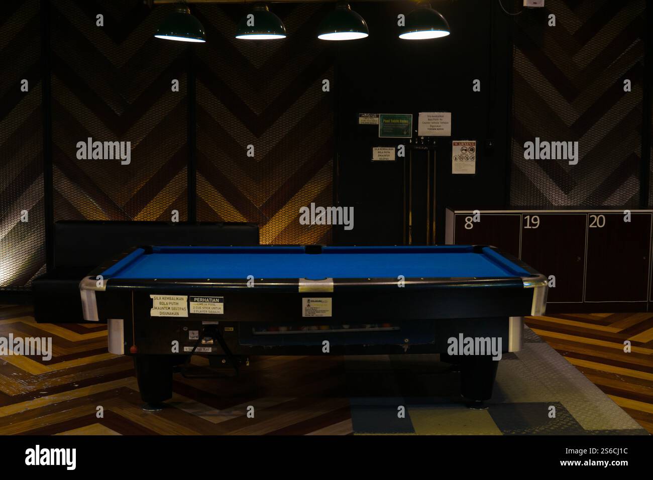 Pool table room with notification notice and sticker at the wall Stock ...