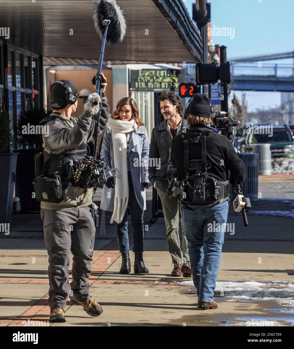 Actors Ella Cannon, left center, and Jason Tobias walk along Second ...