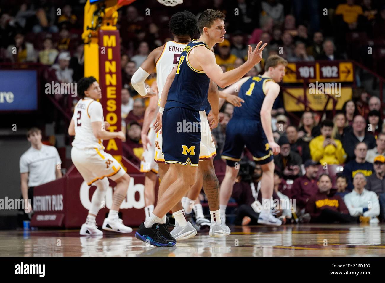 Michigan forward Will Tschetter (42) points after making a 3-point shot ...
