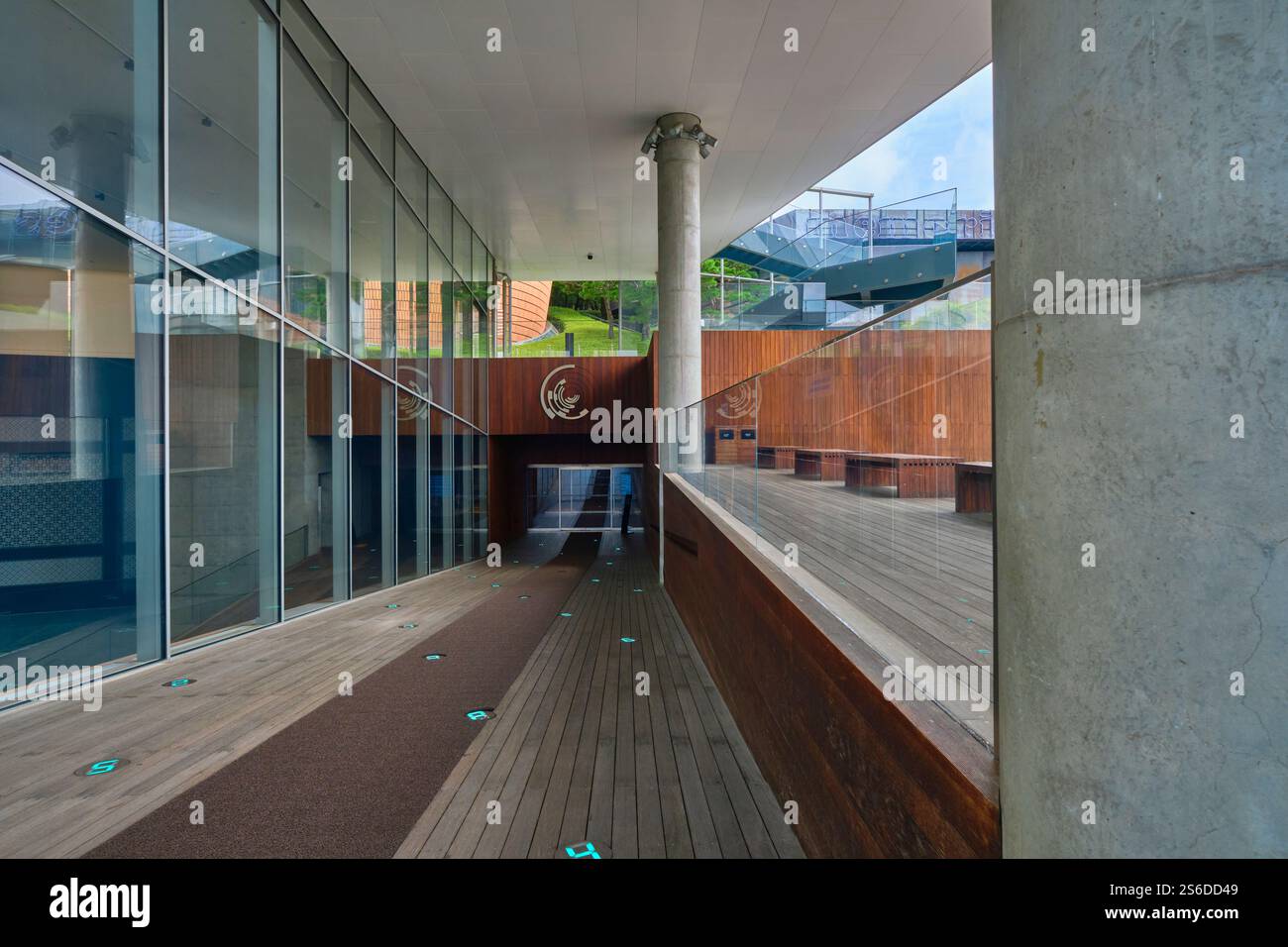 The main front entrance walkway. Exterior view of the modern ...