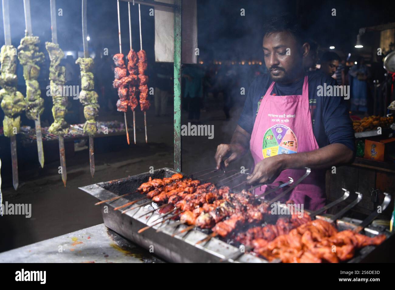 A street vendor prepares mouthwatering kababs at Sohrawardy Udyan, a bustling park in the heart ...