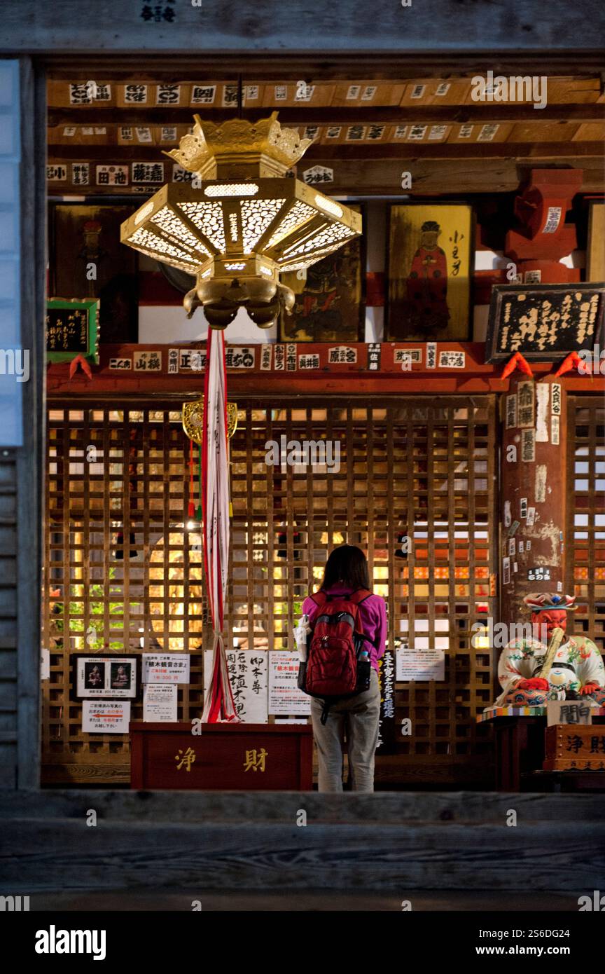 Person praying inside National Treasure Hyakusaiji Temple, one of 3 ...