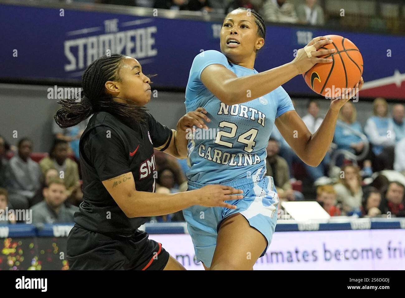 North Carolina guard Indya Nivar (24) drives against SMU guard Zanai ...