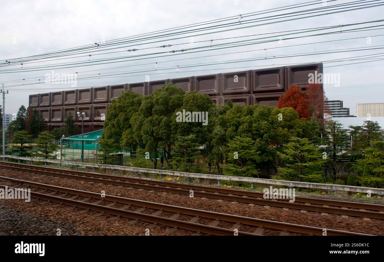 Giant chocolate bar seen from JR train line in Takatsuki near Osaka ...