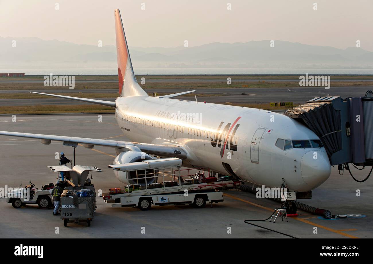 Japan Airlines (JAL) passenger jet airplane being serviced on the ...