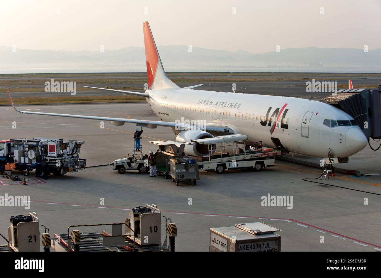 Japan Airlines (JAL) passenger jet airplane being serviced on the ...
