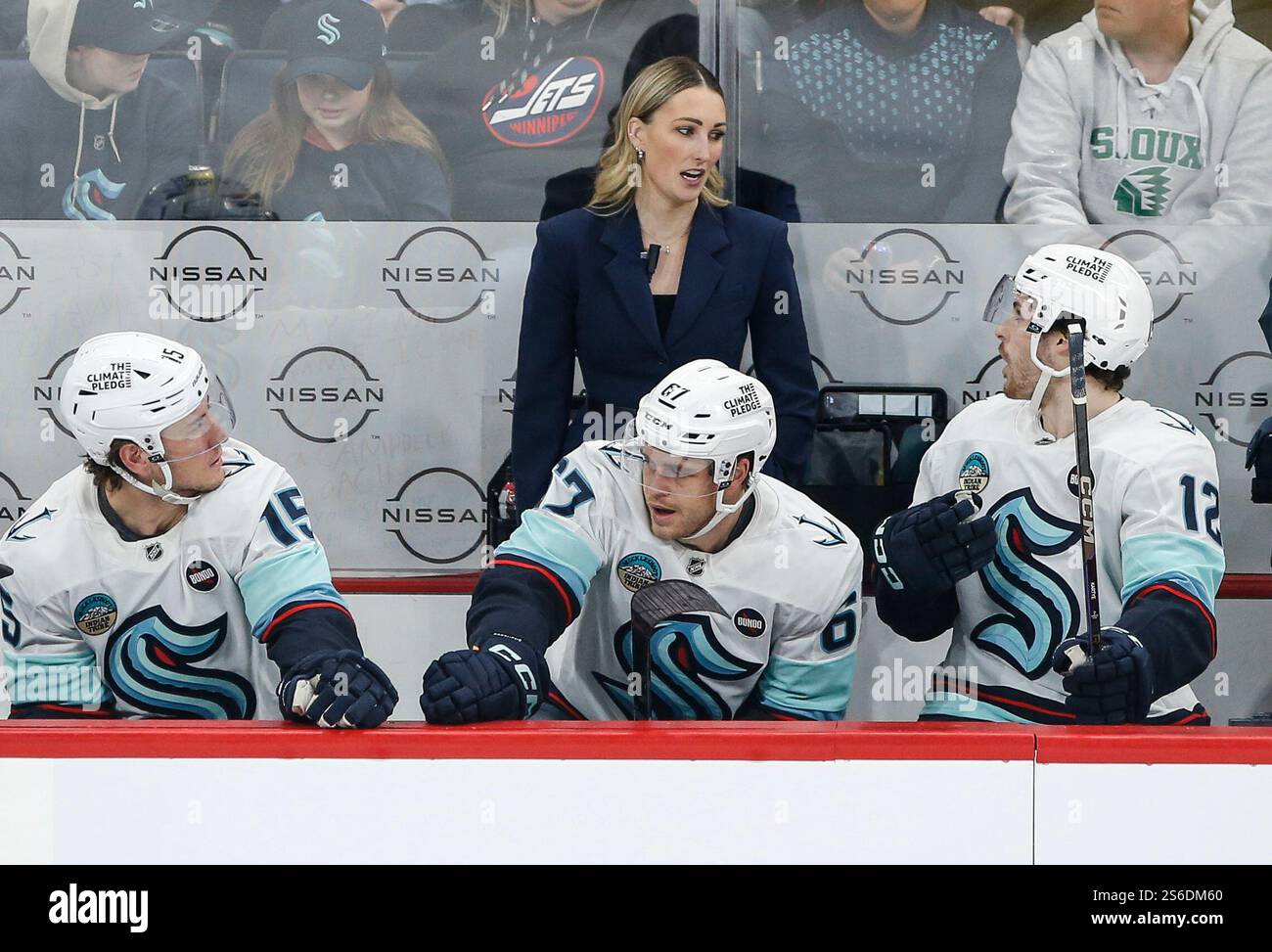 Seattle Kraken assistant coach Jessica Campbell, top center, talks to ...