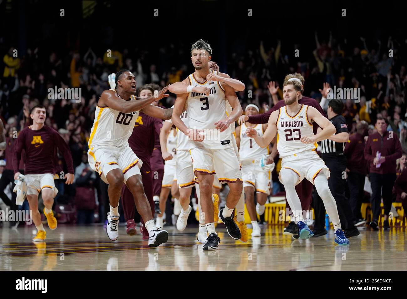 Minnesota forward Dawson Garcia (3) celebrates with teammates after a ...