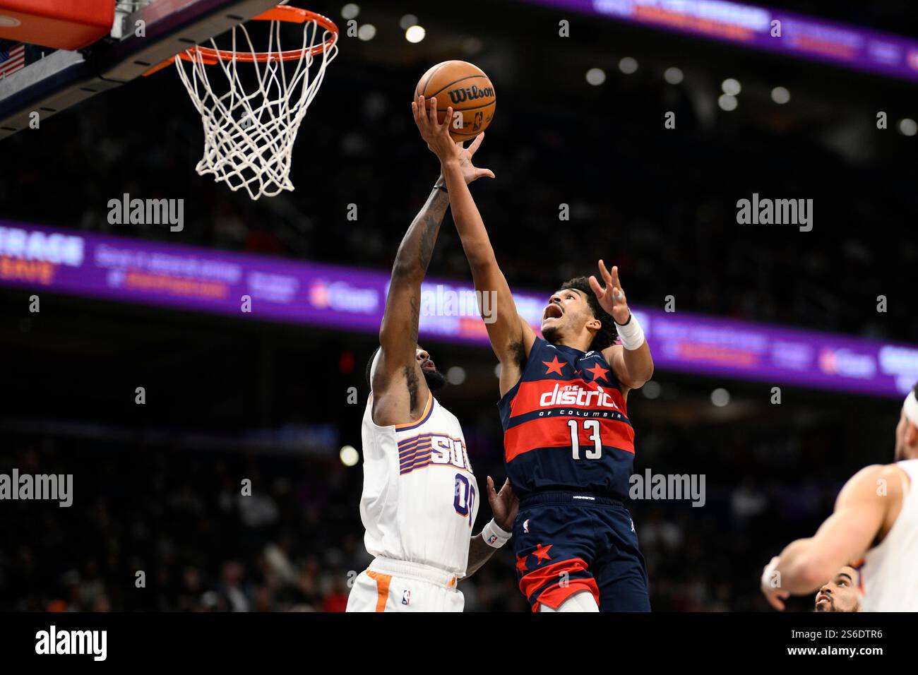 Washington Wizards guard Jordan Poole (13) is fouled by Phoenix Suns ...