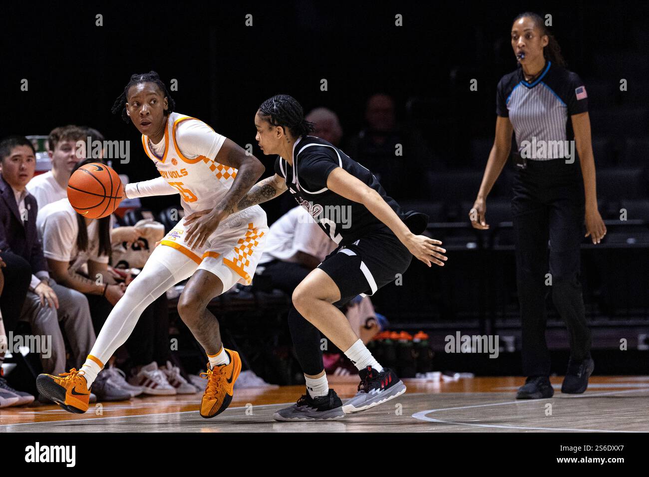 Tennessee guard Talaysia Cooper (55) dribbles as she's defended by Mississippi State guard ...