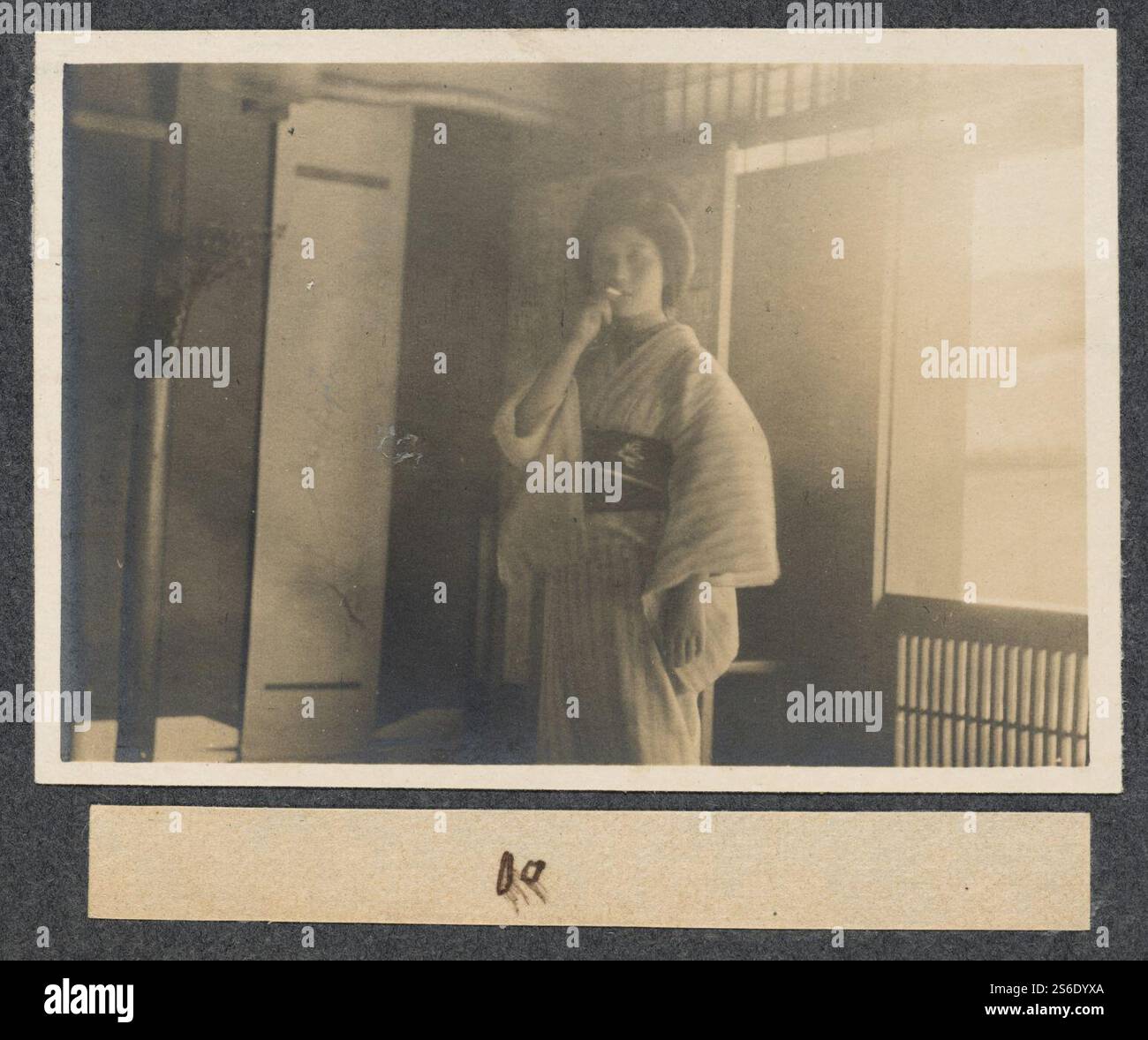 Geisha girl smoking Kyoto 1905 Stock Photo - Alamy