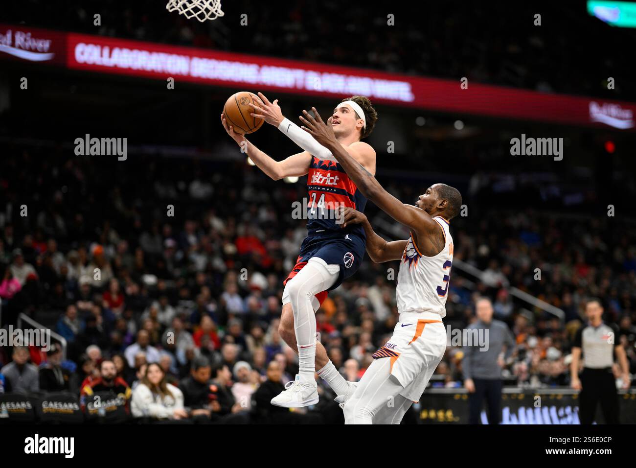 Washington Wizards forward Corey Kispert (24) goes to the basket past ...