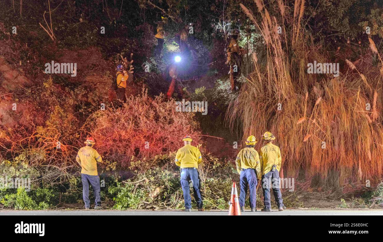 Pacific Palisades, California, USA. 15th Jan, 2025. Cal Fire crew work ...