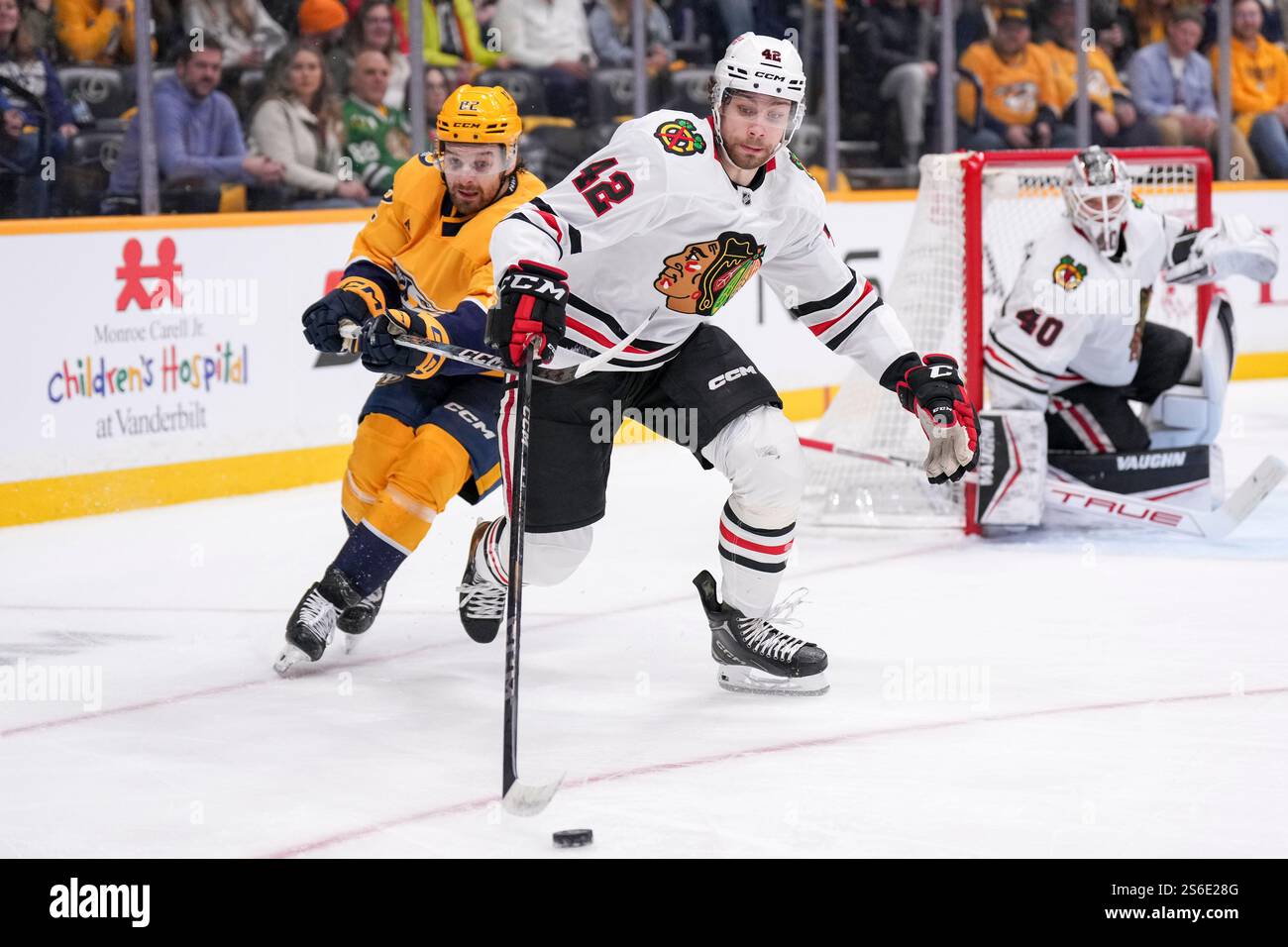 Chicago Blackhawks defenseman Nolan Allan (42) chases the puck past ...