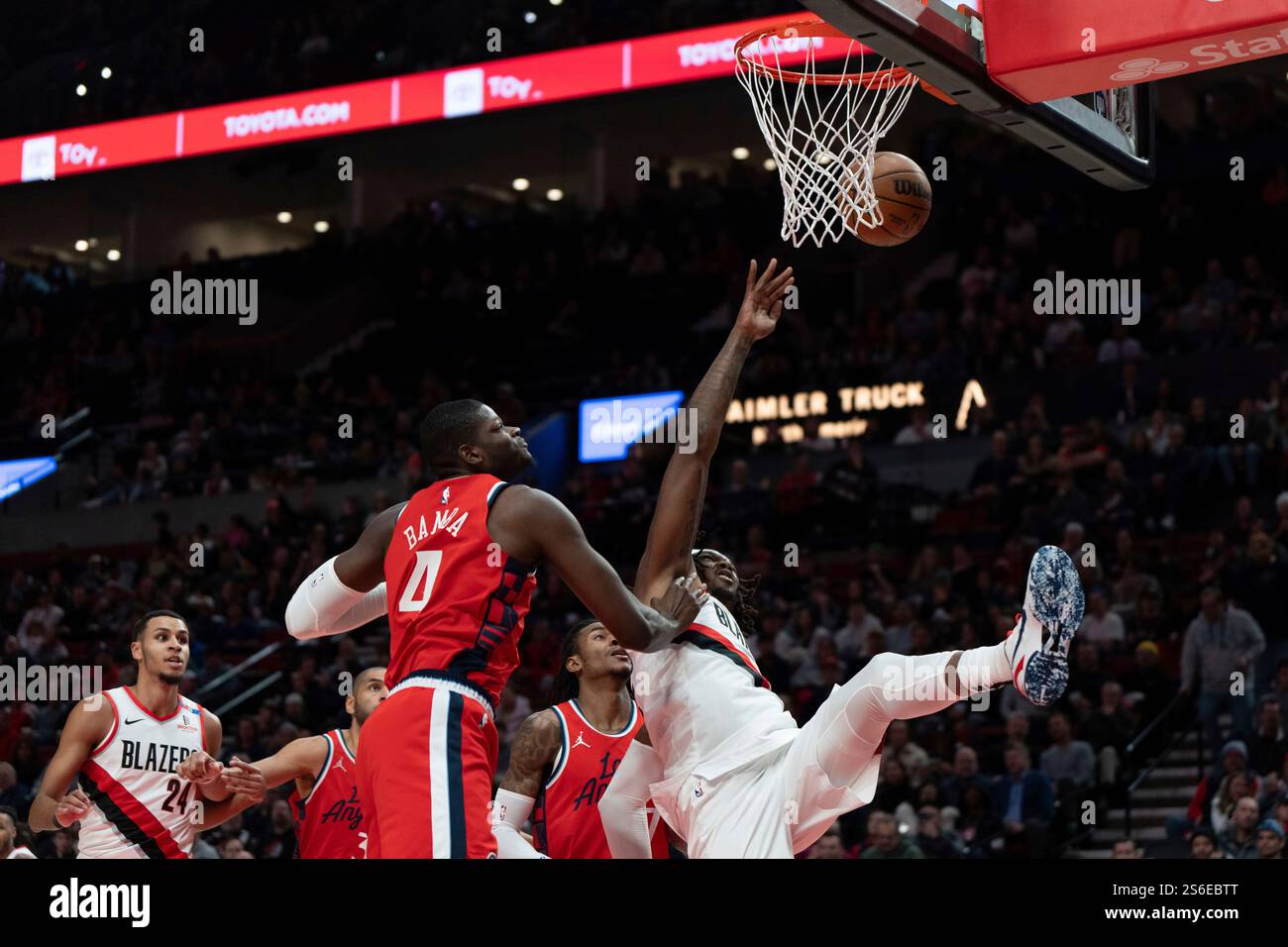 Portland Trail Blazers center Robert Williams III, right, watches his ...