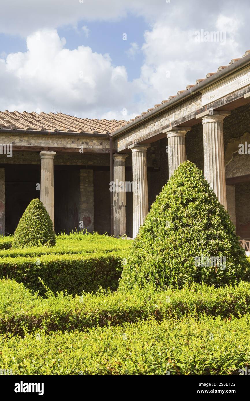 Large old building structure with columns and inner garden courtyard ...