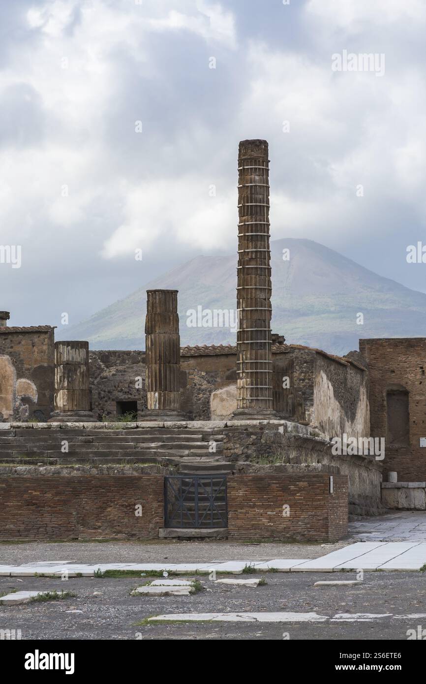Old stone columns supported by braces and terracotta brick wall ...