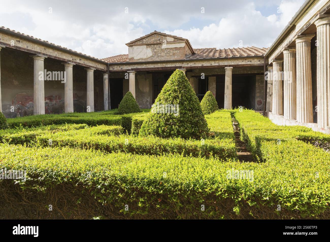 Large old building structure with columns and inner garden courtyard ...