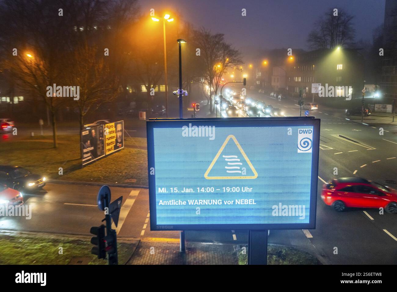 Dense fog, with visibility partly below 100 metres, city centre traffic ...
