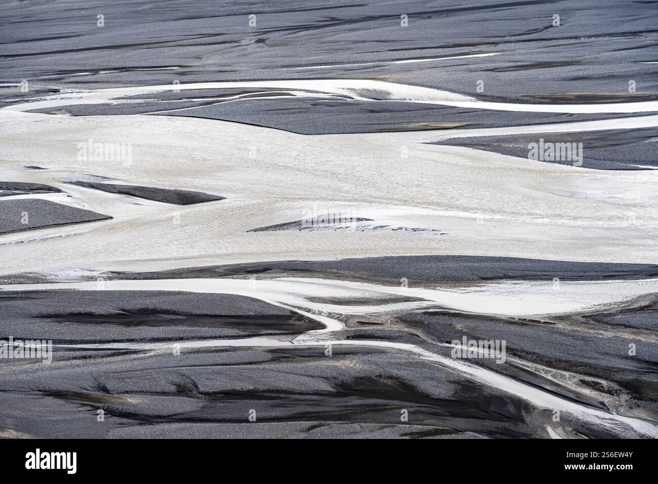 Detail, structure, river course in a gravel bed with black sand ...