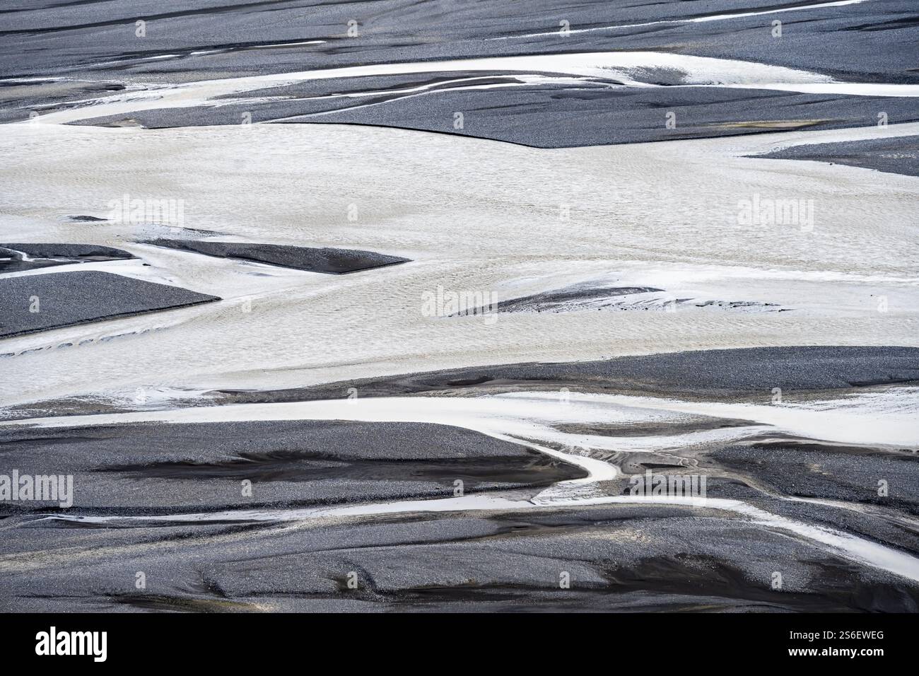 Detail, structure, river course in a gravel bed with black sand ...
