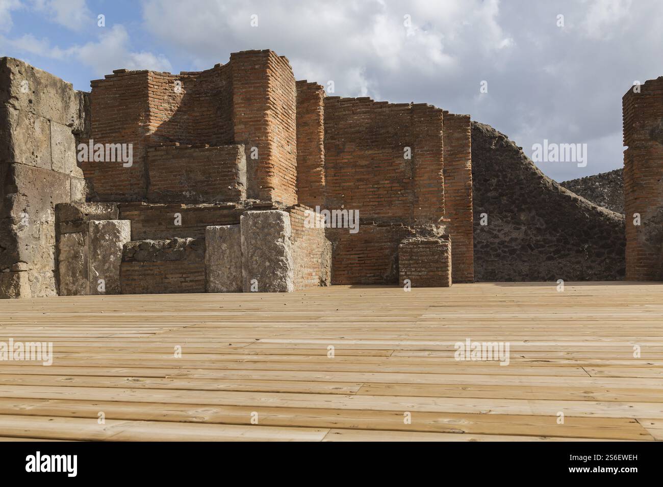 Wood plank decking and remnants of an old terracotta brick and stone ...