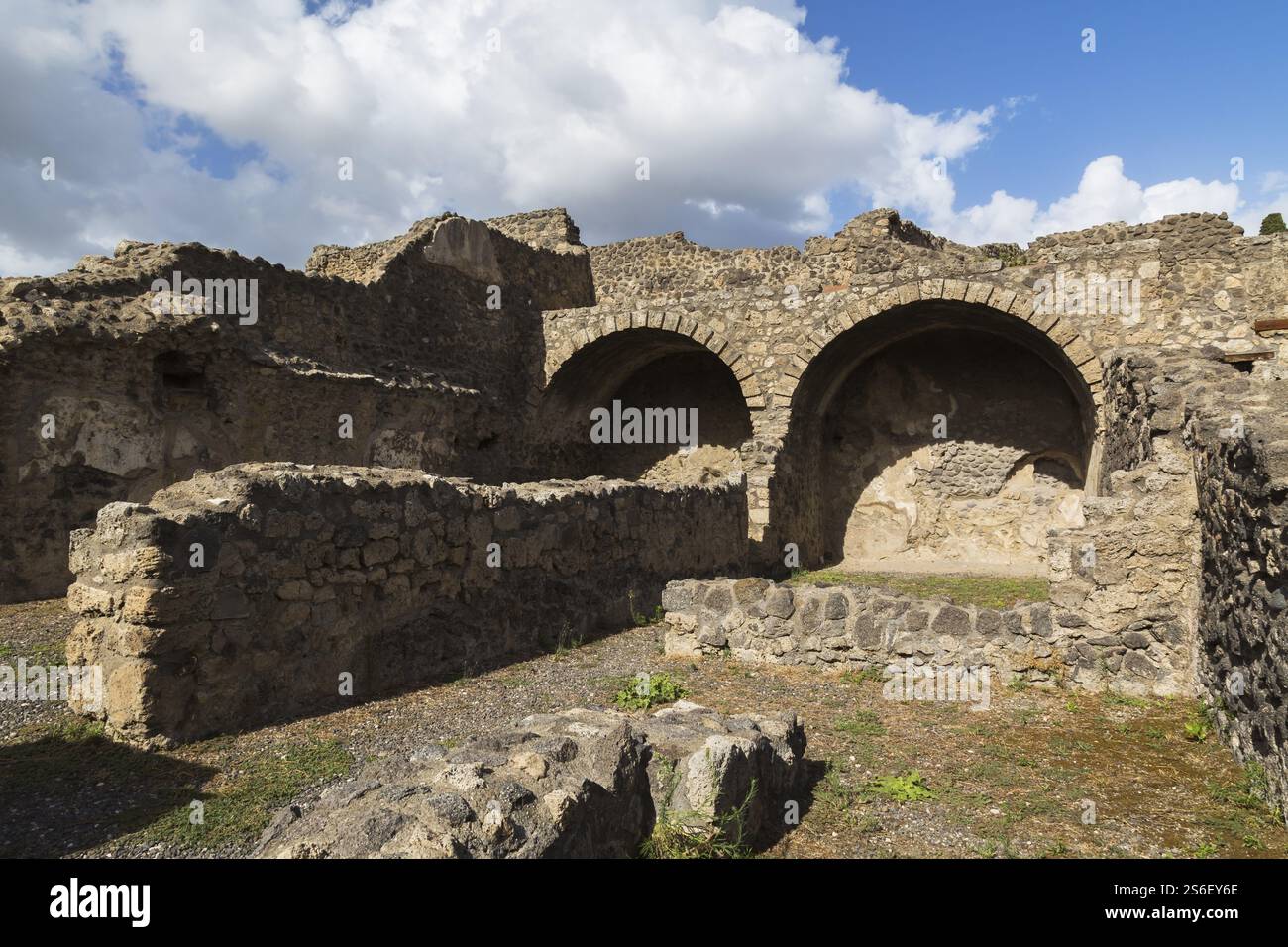 Old stone wall structure with arched recesses at the ancient ruins of ...