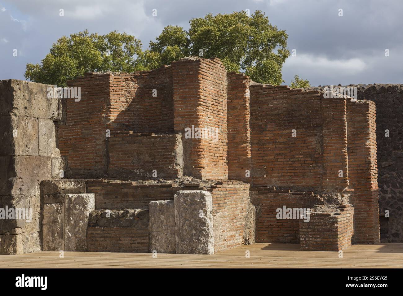 Wood plank decking and remnants of an old terracotta brick and stone ...