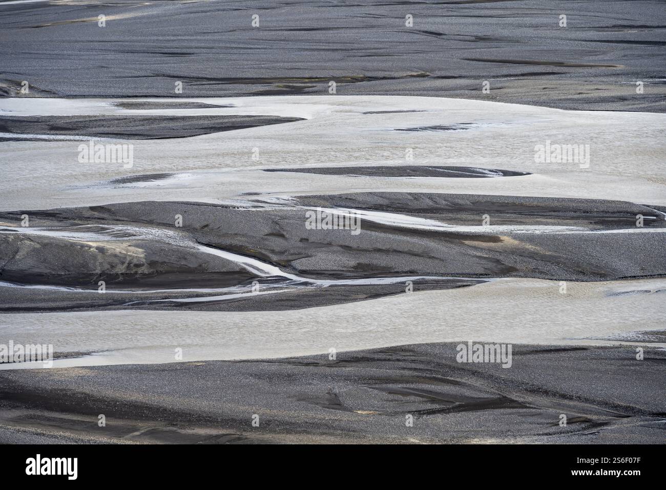 Detail, structure, river course in a gravel bed with black sand ...
