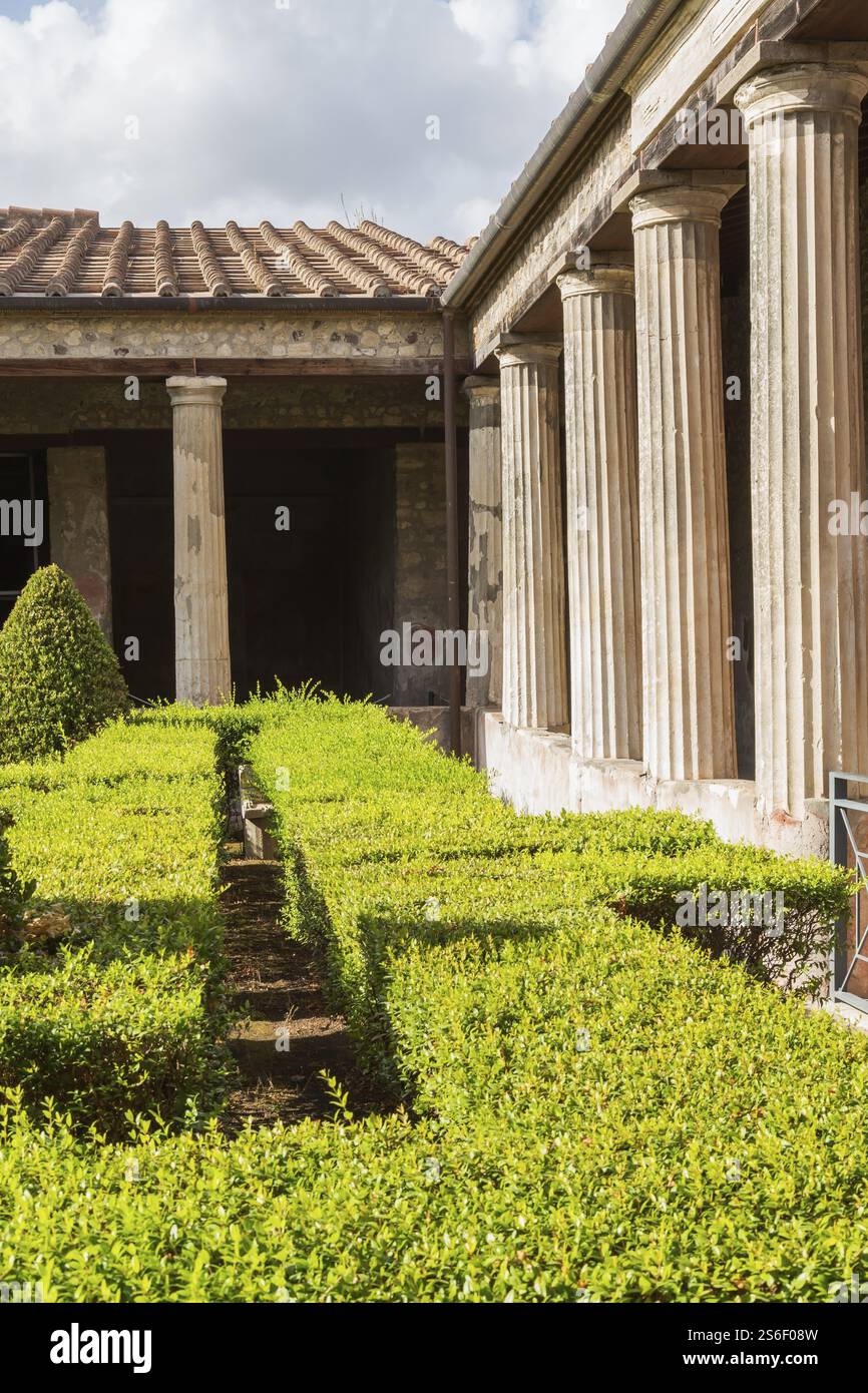 Large old building structure with columns and inner garden courtyard ...