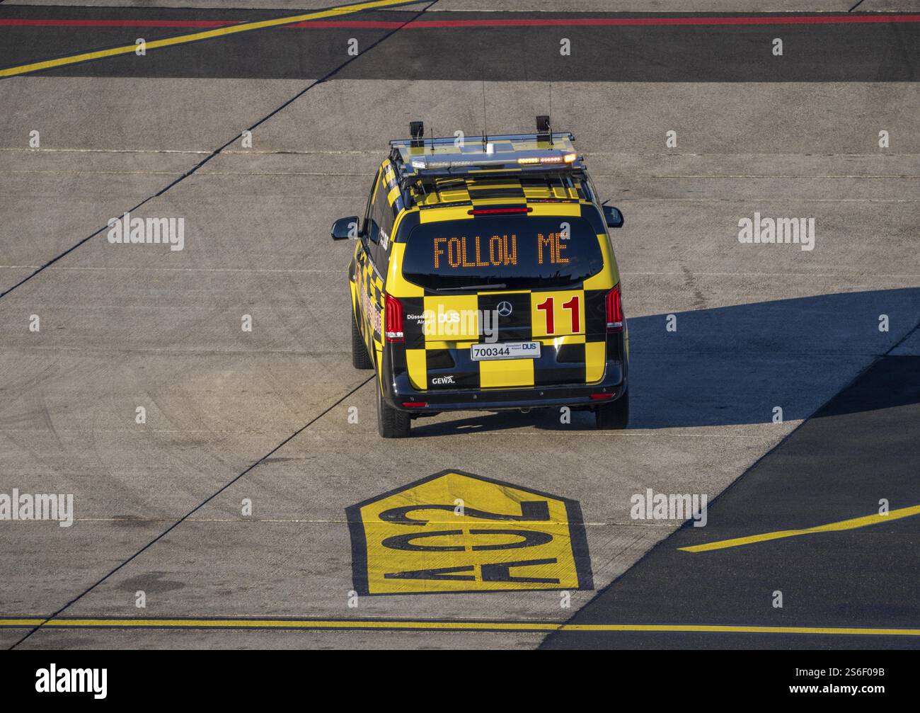 Follow Me vehicle, pilot vehicle, apron supervisor, marshal, directs an ...