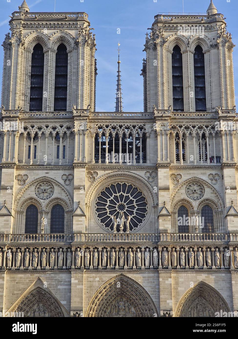 Notre-Dame Cathedral in Paris facade details featuring its iconic twin towers, intricate Gothic ...