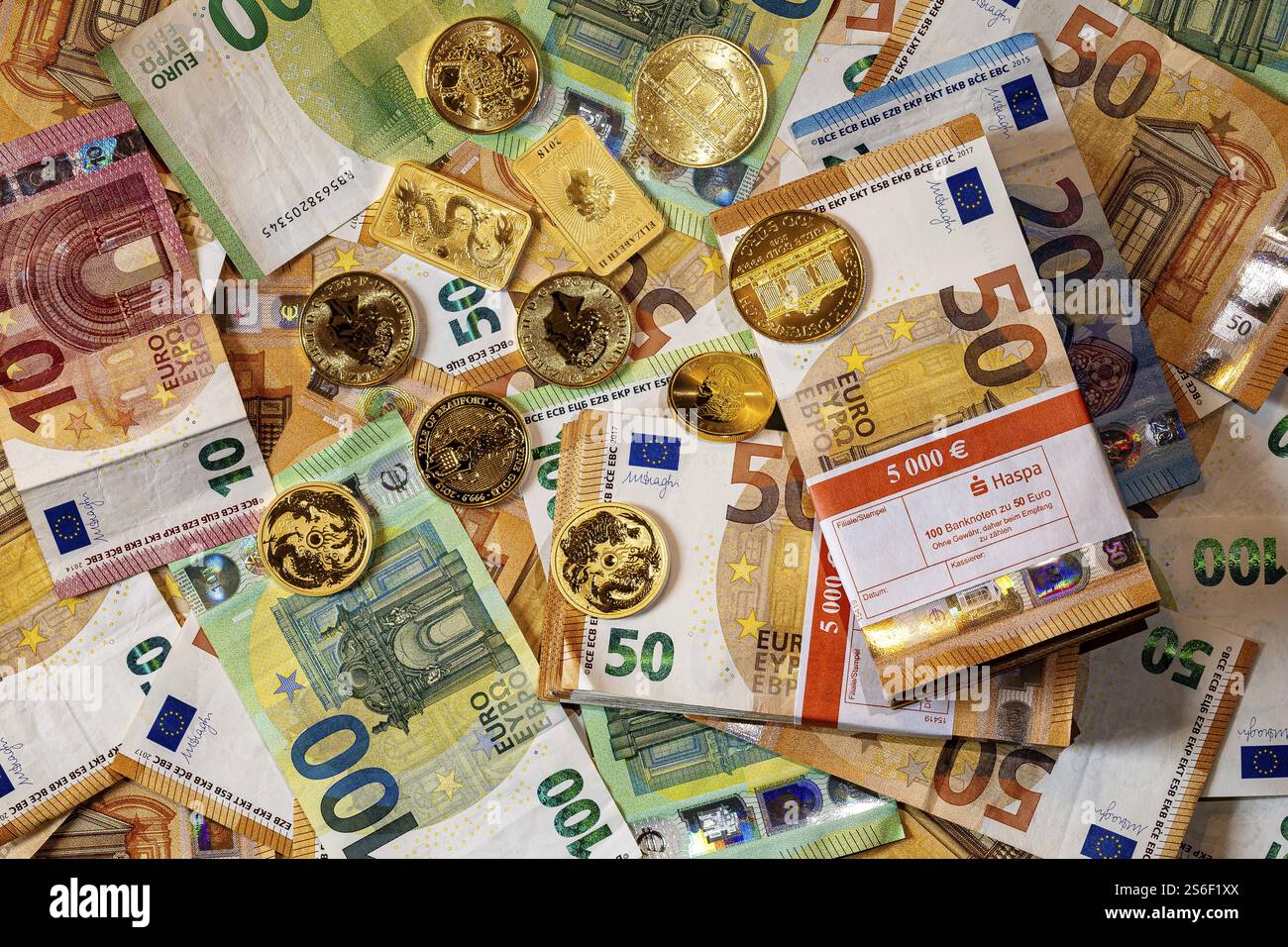 Gold and banknotes, euros and gold coins and gold bars, piles and ...