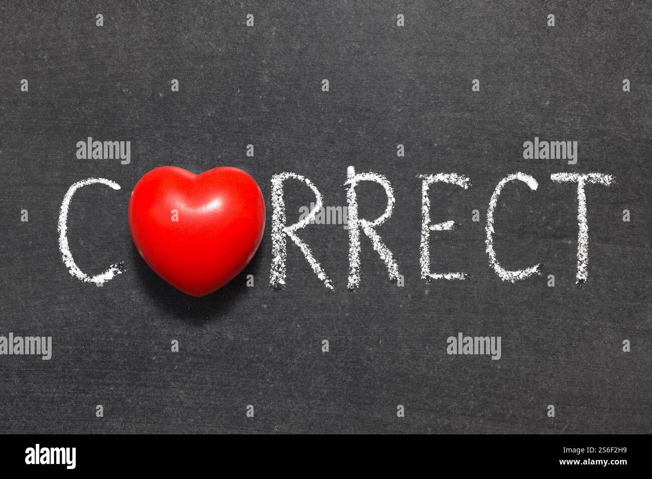 correct word handwritten on chalkboard with heart symbol instead of O ...