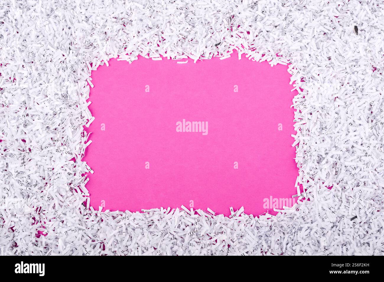 pink background with shredded paper frame around Stock Photo - Alamy