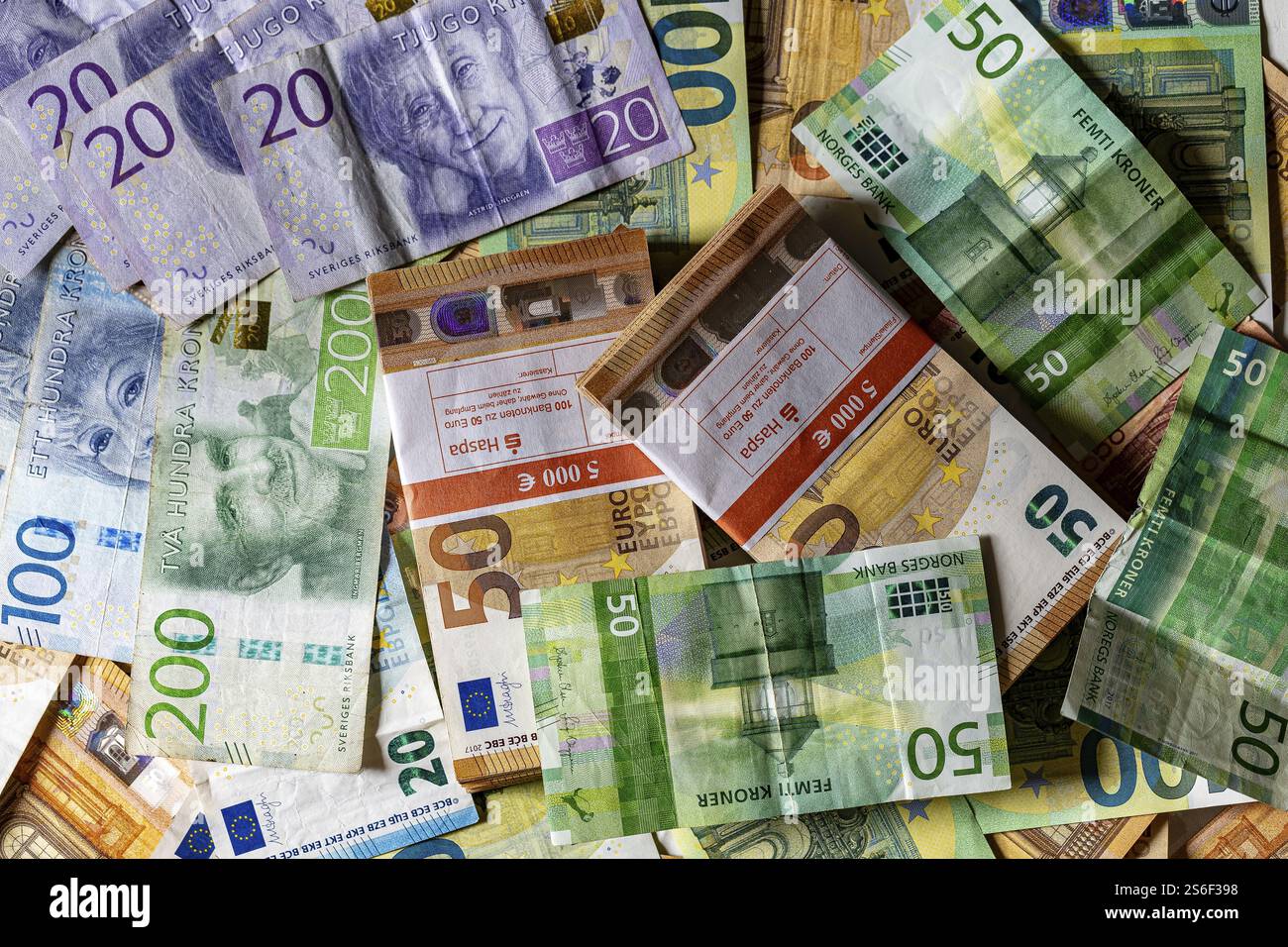 Banknotes, euro, Norwegian krone and Swedish krona, piles and bundles ...