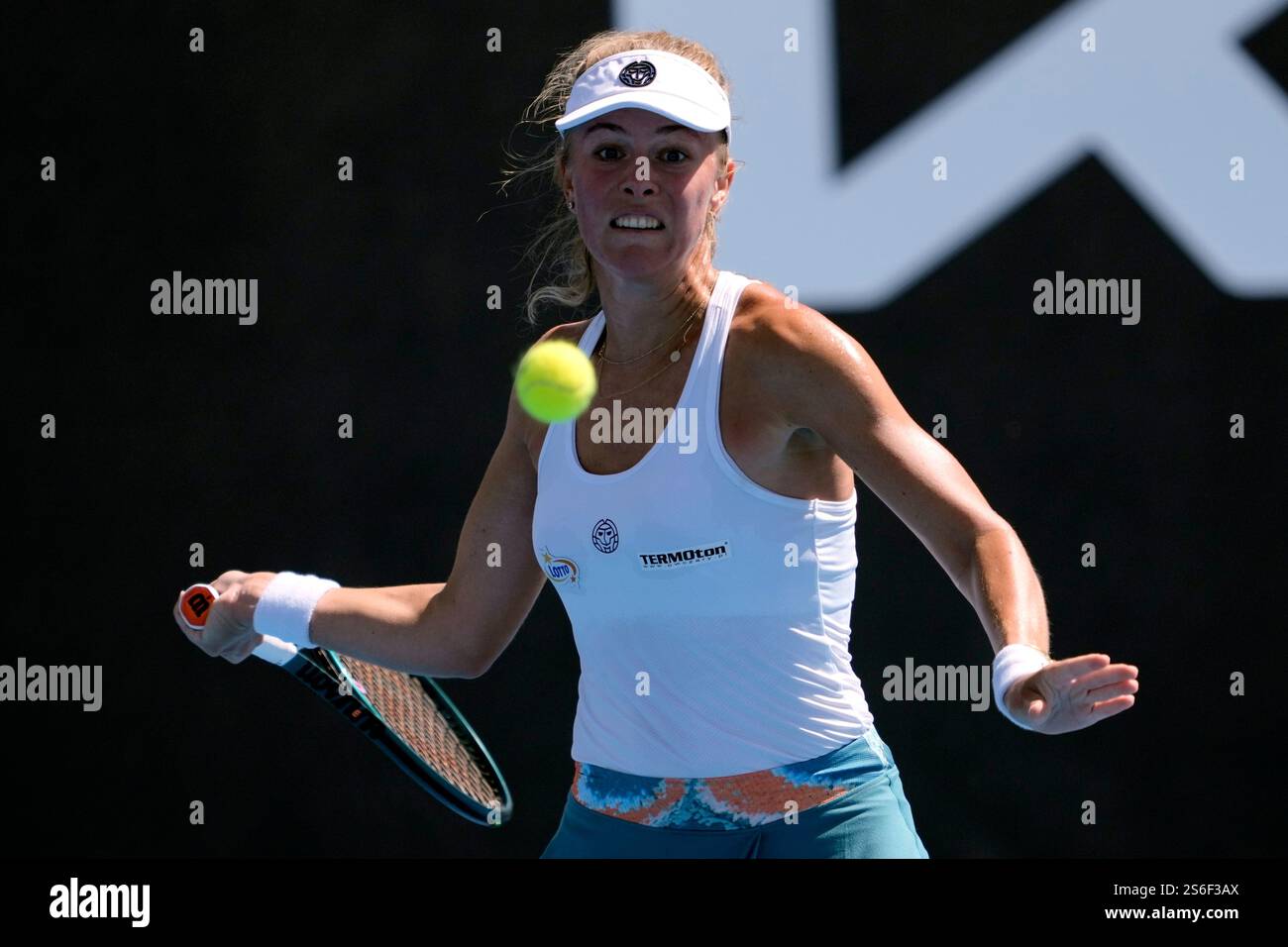 Magdalena Frech of Poland plays a forehand return to Mirra Andreeva of ...