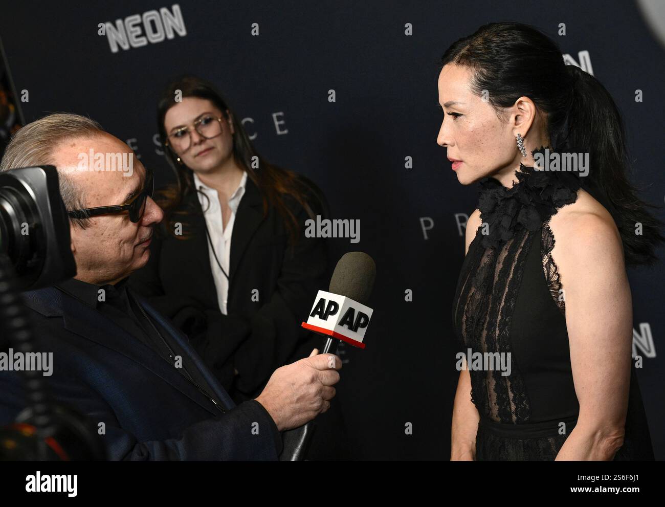 Lucy Liu, right, speaks with Associated Press television producer John ...