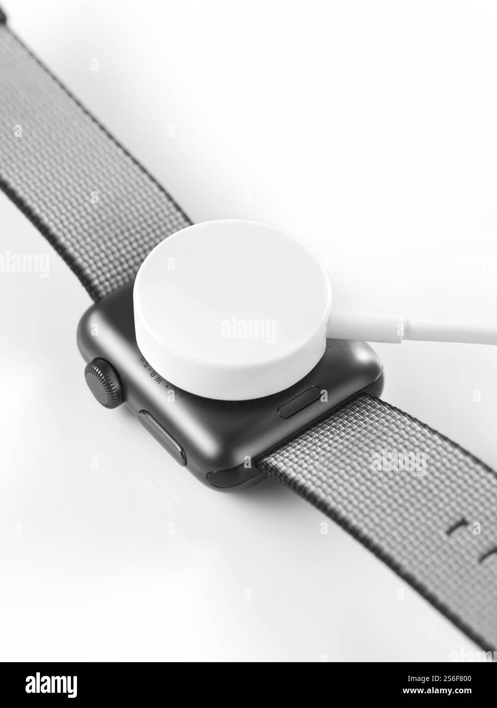 Apple Watch smartwatch charging wirelessly by inductive wireless ...