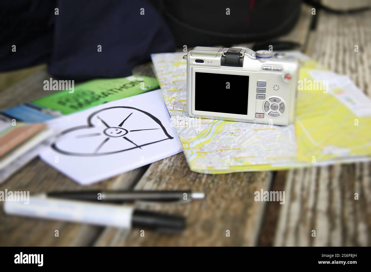 A collage of a photo tour with camera and map Stock Photo - Alamy