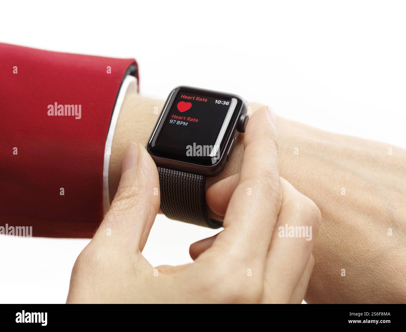 Woman hand with Apple Watch smartwatch on her wrist measuring her heart ...