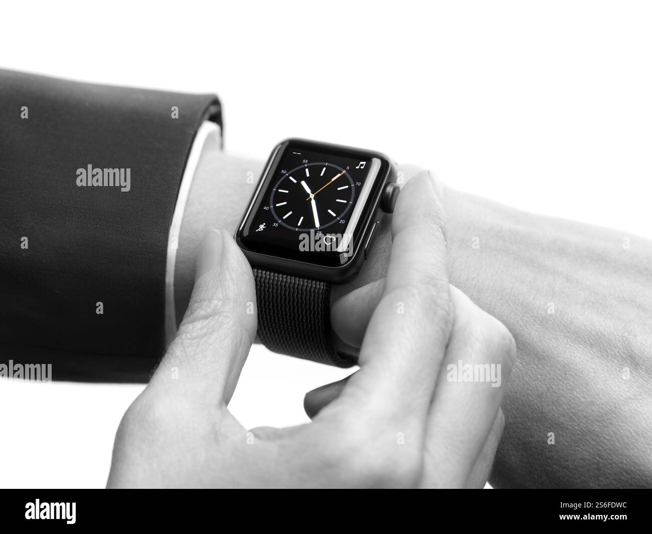 Woman hand with Apple Watch smartwatch on her wrist displaying a clock ...