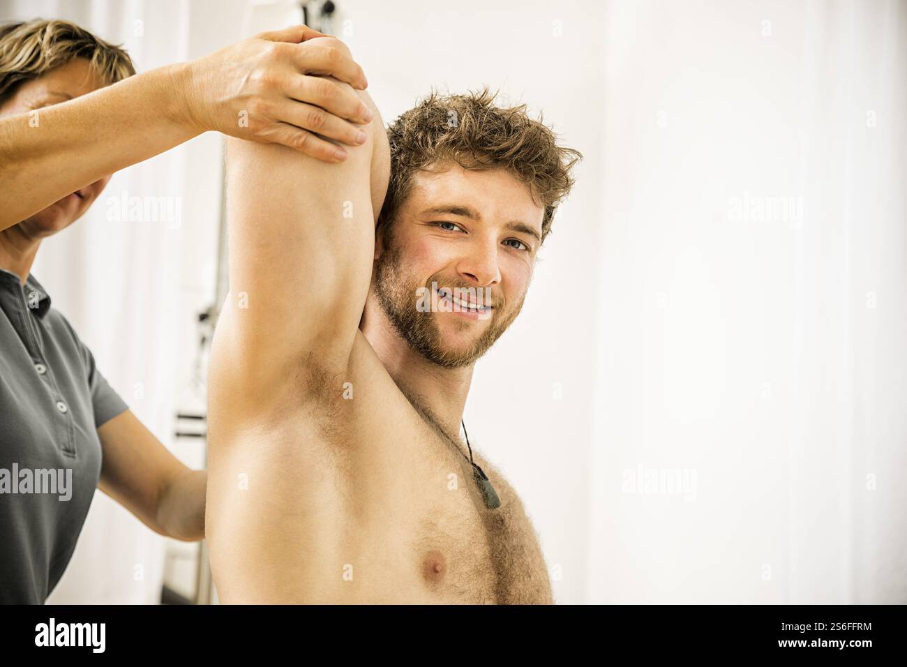 An image of a young man at the physio therapy Stock Photo - Alamy