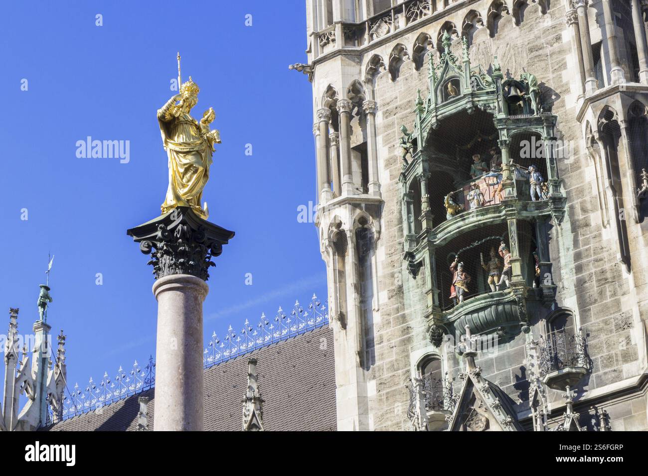 An image of the golden Maria statue in Munich with the city hall Stock ...