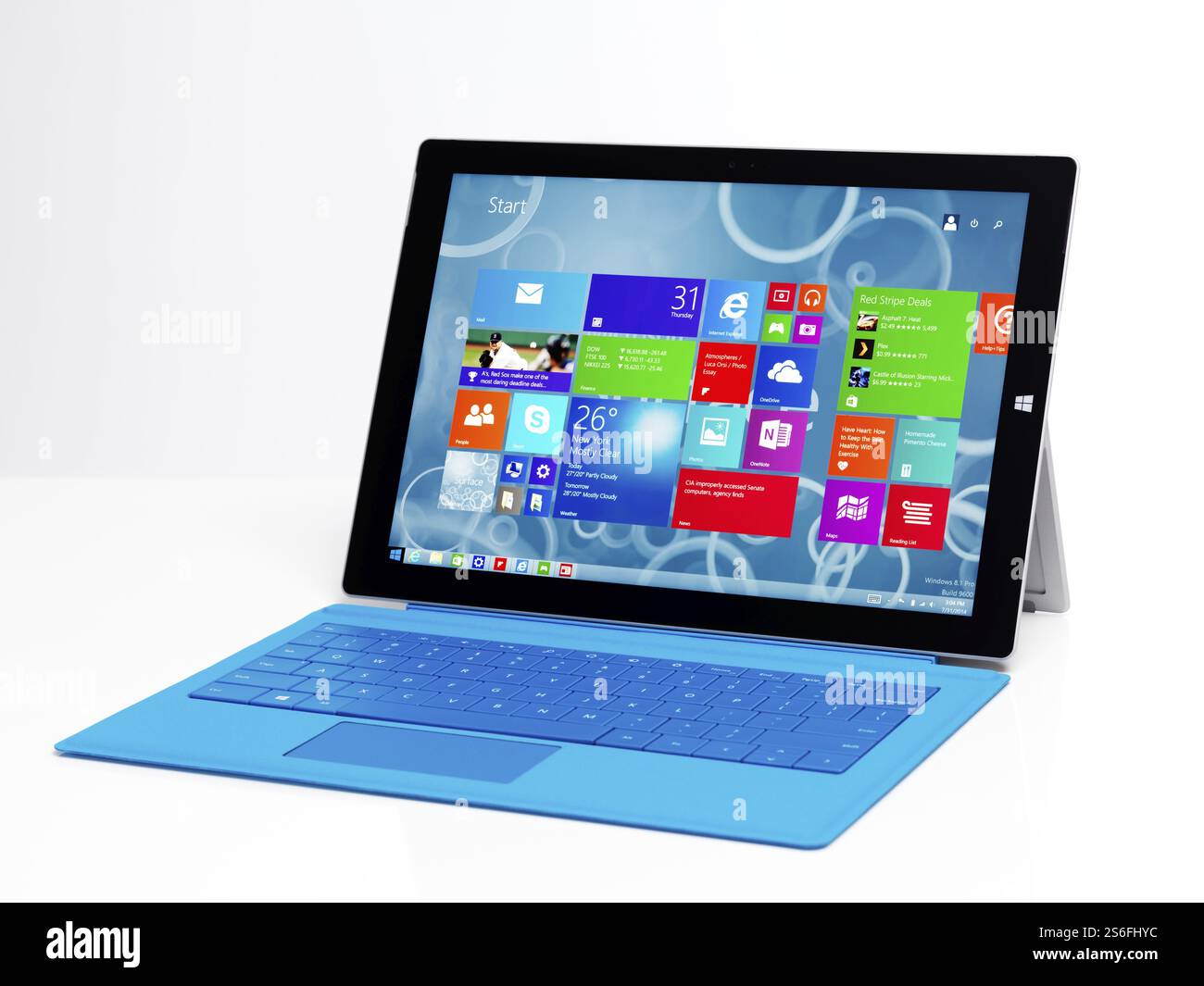 Microsoft Surface Pro 3 tablet computer with a blue keyboard isolated ...