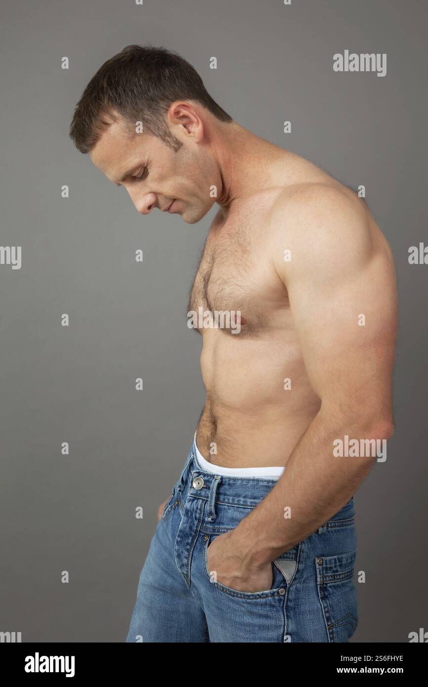 An image of a handsome muscle man side view Stock Photo - Alamy