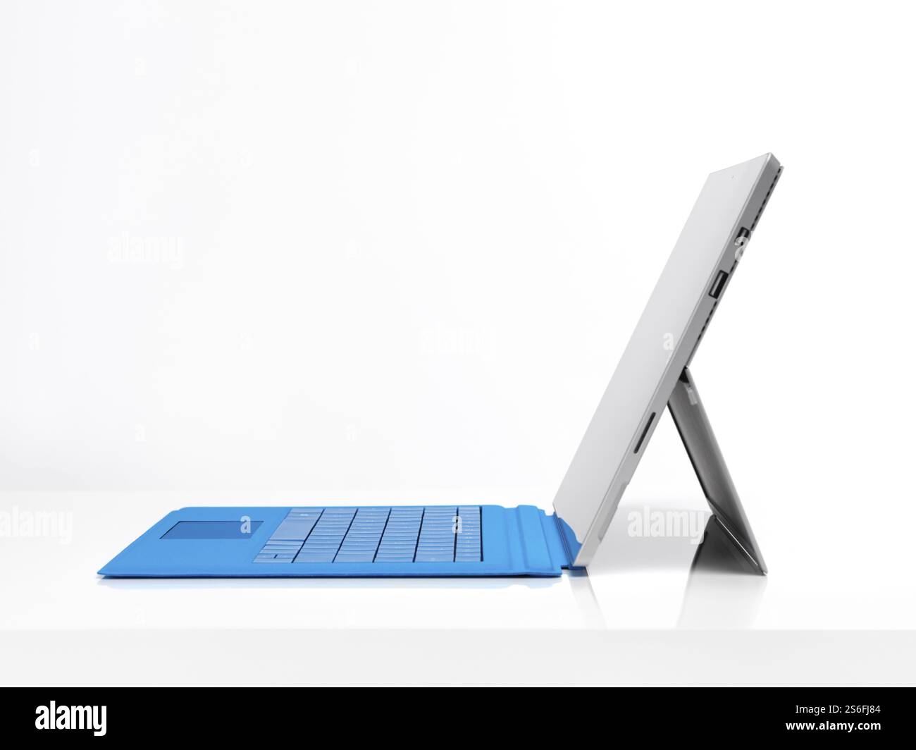Microsoft Surface Pro 3 tablet computer with a blue keyboard side view ...