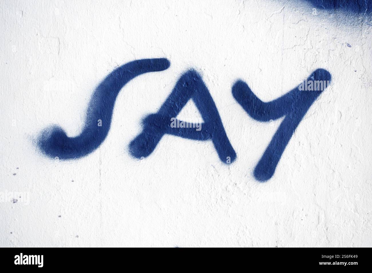An image of a simple graffiti word say on a wall Stock Photo - Alamy