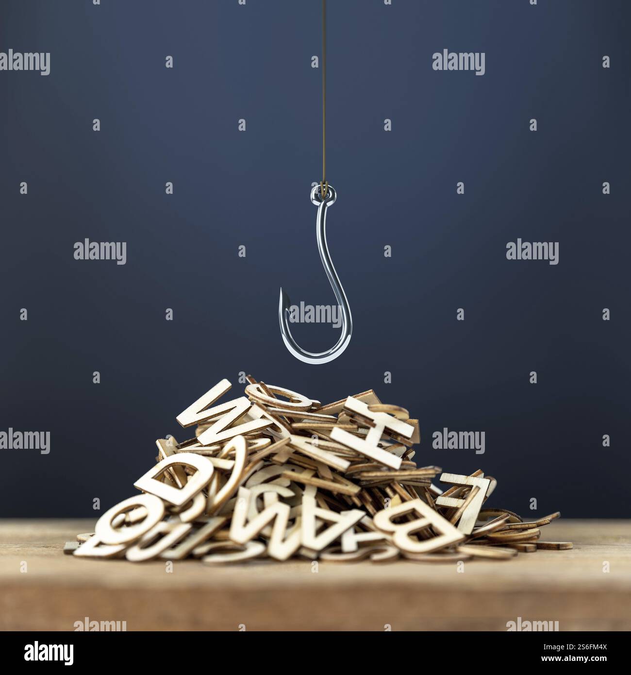 An image of a pile of wooden letters with a hook Stock Photo - Alamy